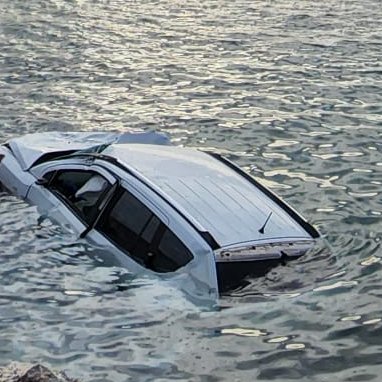Photos: Vehicle Overboard By Causeway - Bernews
