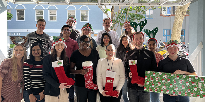 Deloitte Helps 13 Families Enjoy Holiday Cheer - Bernews