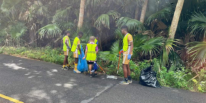 DaRock Footballers Help Clean Up Bermuda - Bernews